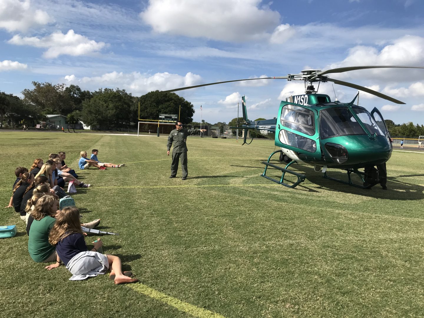 KCS Dads Land Helicopter on Football Field - Keswick Christian